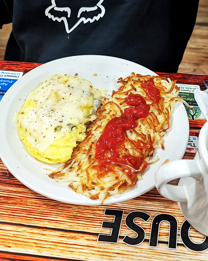 Hash browns or work of art? Golden, crispy potato canvas with a Jackson Pollock splash of ketchup. Edible modernism at its finest.