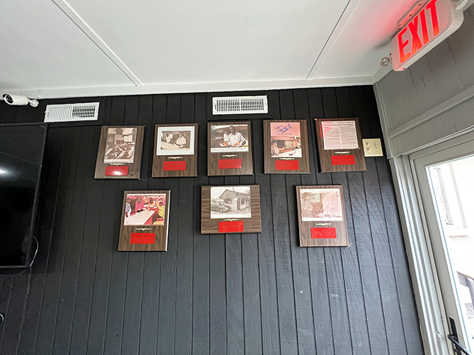 A wall of fame that tells the smoky story of Archibald's. It's like a barbecue history lesson, but way more delicious.