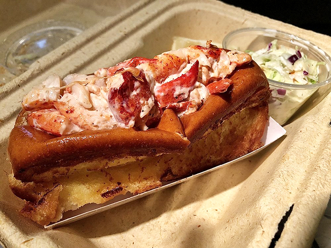 The lobster roll that launched a thousand road trips! This beauty is so packed with sweet meat, it's like the ocean's gift to carb lovers everywhere.