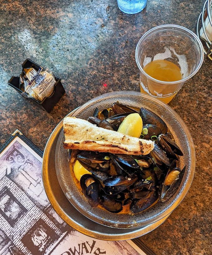 Mussels worth flexing about! These plump beauties, swimming in savory broth, are a testament to the kitchen's seafood prowess.