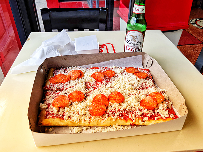 The perfect pairing! Nothing says "treat yourself" quite like a DiCarlo's pizza and an ice-cold Yuengling.