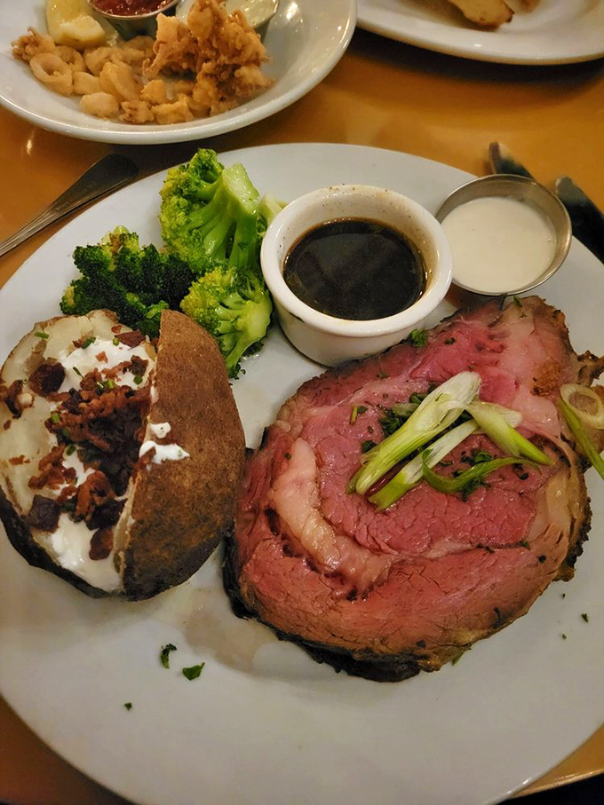 The holy trinity of comfort: prime rib, baked potato, and broccoli. It's like a hug for your taste buds.