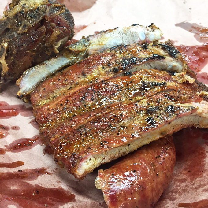 A symphony of smoke and spice! These ribs are so tender, they practically fall off the bone with a stern look. Napkins required, but totally worth it.