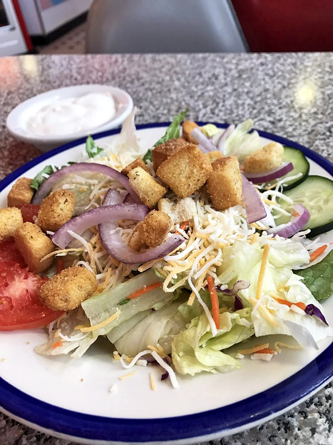 A salad that doesn't feel like punishment. Fresh, crisp, and colorful, it's the opening act before the headlining comfort food.