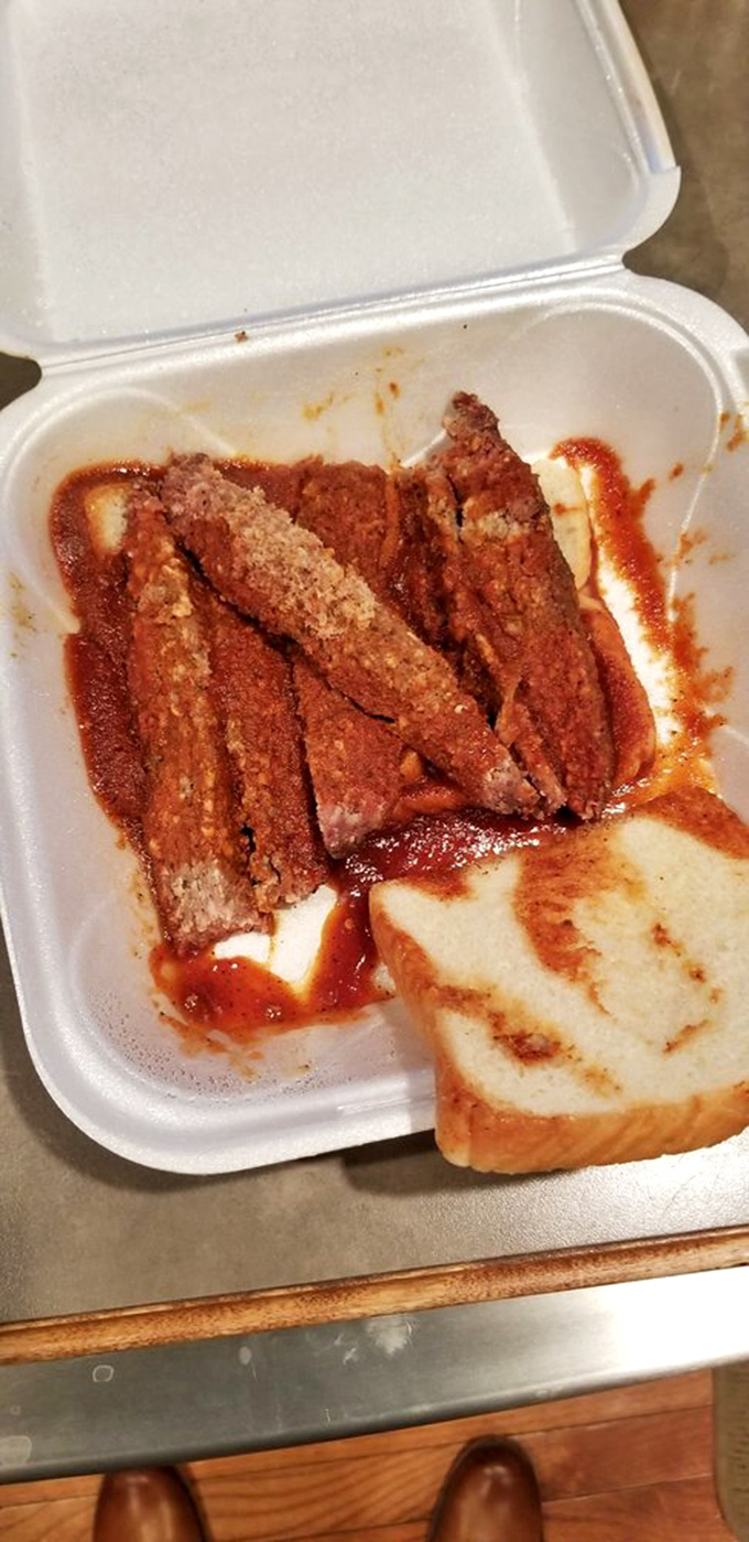 That sauce-glazed sandwich isn't just a meal, it's a masterpiece of meat architecture.