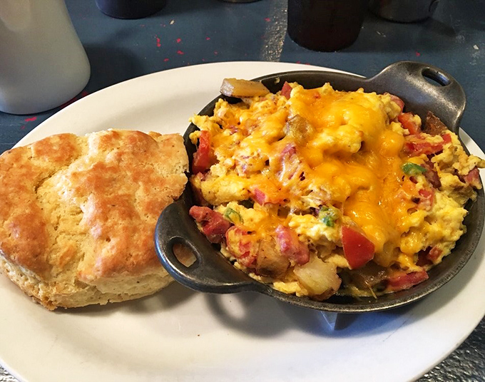 Skillet sensation! This hearty dish is like a warm hug for your stomach, with a biscuit sidekick for good measure.