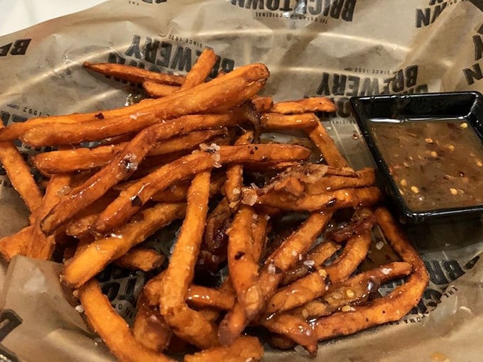 These aren't just sweet potato fries; they're a crispy orange revelation that makes regular fries seem like they're not even trying.