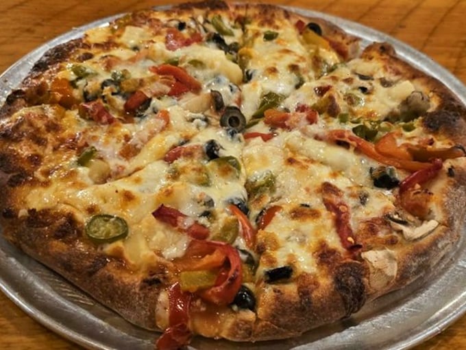 A vegetarian's dream come true! This colorful pie proves that you don't need meat to have a pizza party in your mouth.
