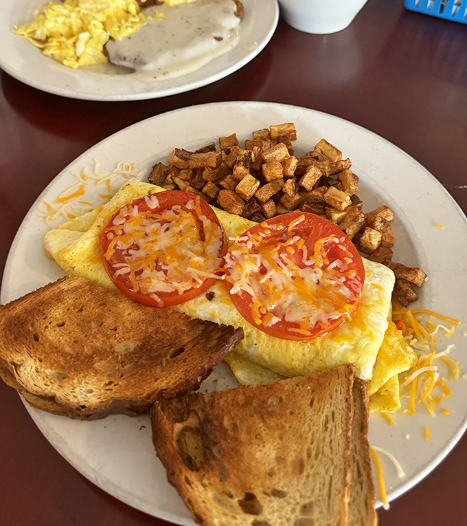 The Veggie Omelet: Proof that eating your greens can be downright indulgent. It's a garden party wrapped in a fluffy egg blanket.
