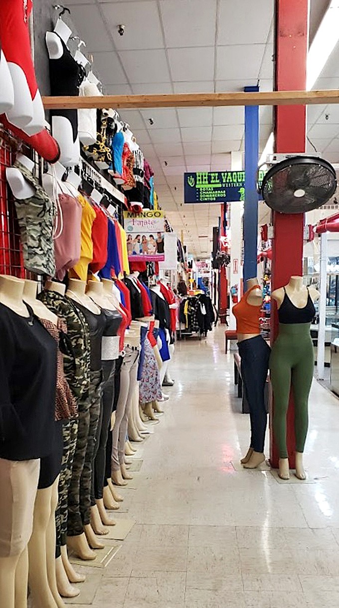 A fashion runway of mannequins modeling everything from casual tees to night-out ensembles. Project Runway with bargain basement price tags.