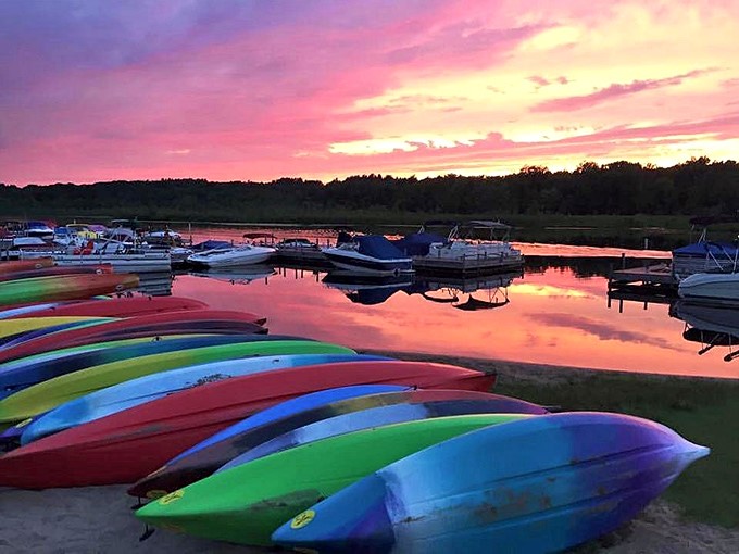 Sunset kayak symphony: Nature's own light show reflected on the water. No special effects needed, just pure, unadulterated beauty.