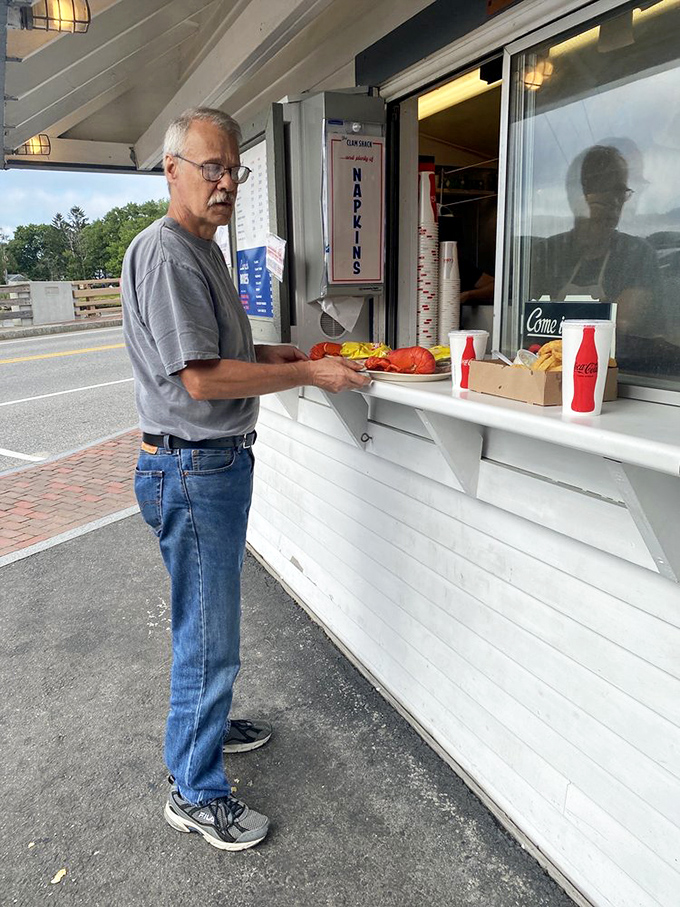 The anticipation is real! This gentleman knows he's moments away from seafood nirvana. We've all been there, buddy.