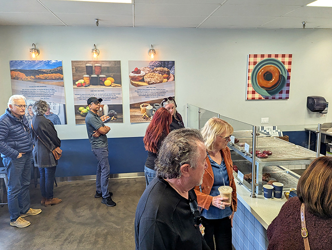 Donut devotees unite! This line of patient patrons proves that good things come to those who wait... especially when sugar is involved.