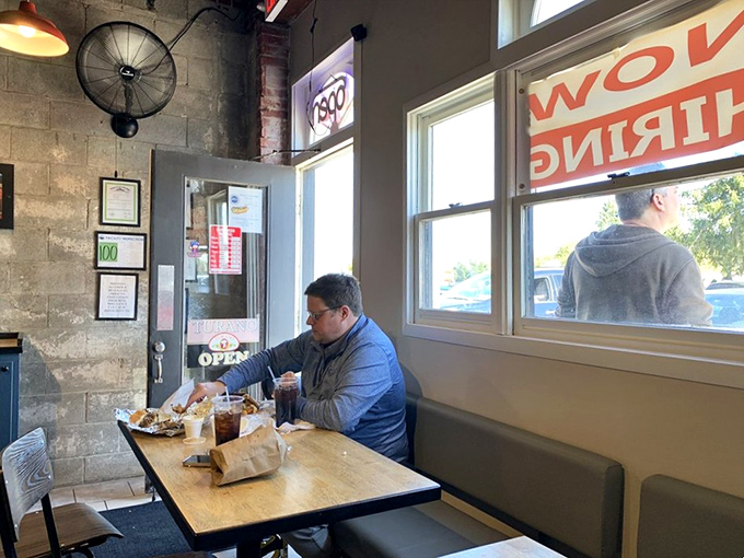 Happiness is a full plate and an empty restaurant. This diner's living his best life, one bite at a time.