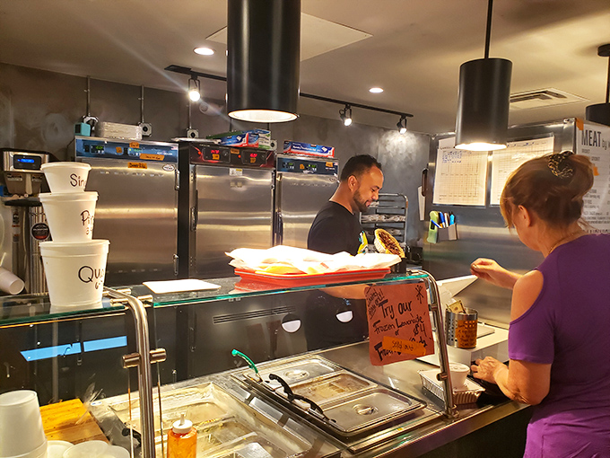 Order up! The bustling counter is like mission control for your BBQ adventure, with friendly faces ready to guide you.