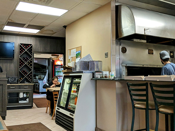 Pizza pilgrims unite! These diners know they're in for a treat. The anticipation is as palpable as the aroma of fresh-baked crust.