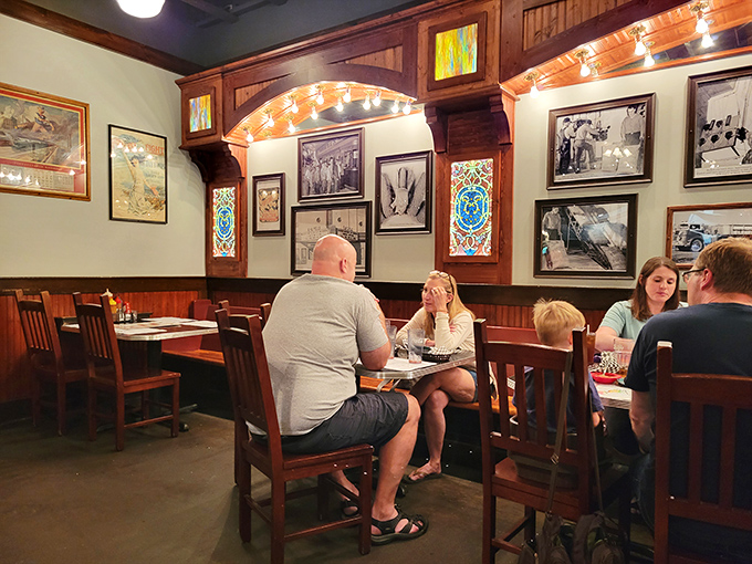 Happy diners in their natural habitat. Notice the telltale signs: sauce-stained fingers and expressions of pure contentment.