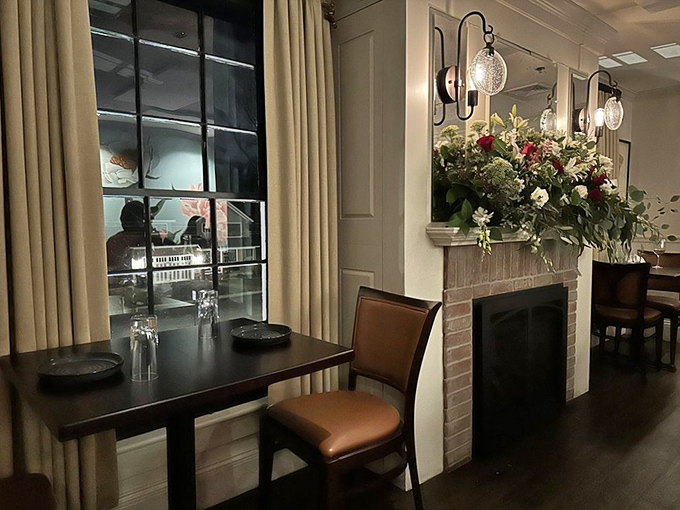 Cozy corner alert! This fireplace nook at The Charles is the perfect spot to warm your toes and your heart, preferably with a steaming bowl of that famous onion soup.
