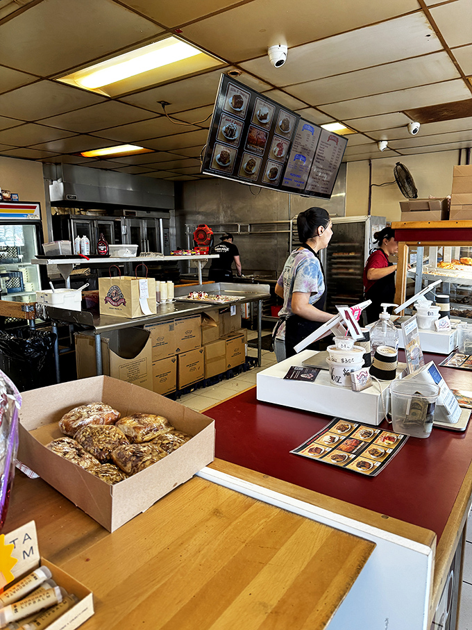 Behind the scenes of sweetness. These kitchen magicians are the Willy Wonkas of the cinnamon roll world, crafting edible joy one swirl at a time.