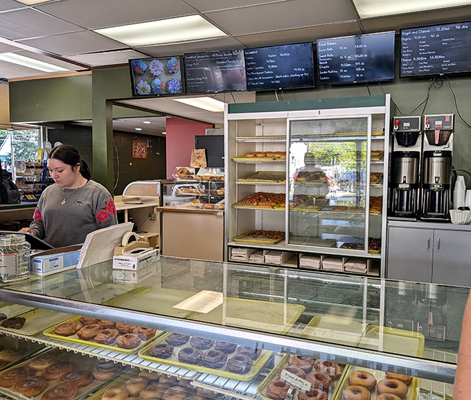 Where the magic happens! The friendly staff and well-stocked display case are a dynamic duo, ready to make your sweetest dreams come true.