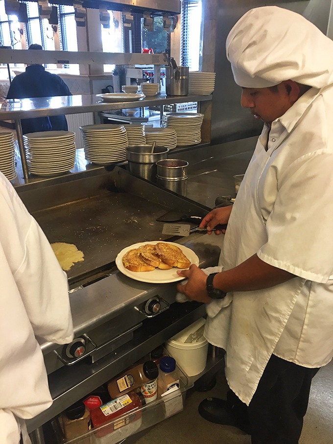Behind the scenes magic: where short-order cooks become breakfast wizards. No wand required, just a spatula.