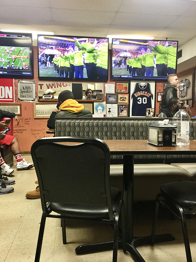 The walls tell stories of loyal customers and local celebrities who've made the pilgrimage to this temple of wing perfection.