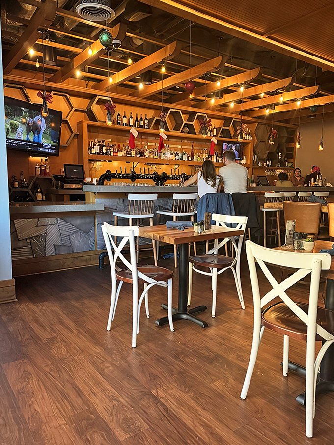 The bar area&mdash;where Southern hospitality meets mixology in a warm wood setting that practically begs you to stay for "just one more."