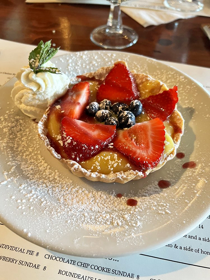 A dessert that's berry delightful! This fruit tart is summer on a plate, crowned with a dollop of cream that's begging to be Instagrammed.