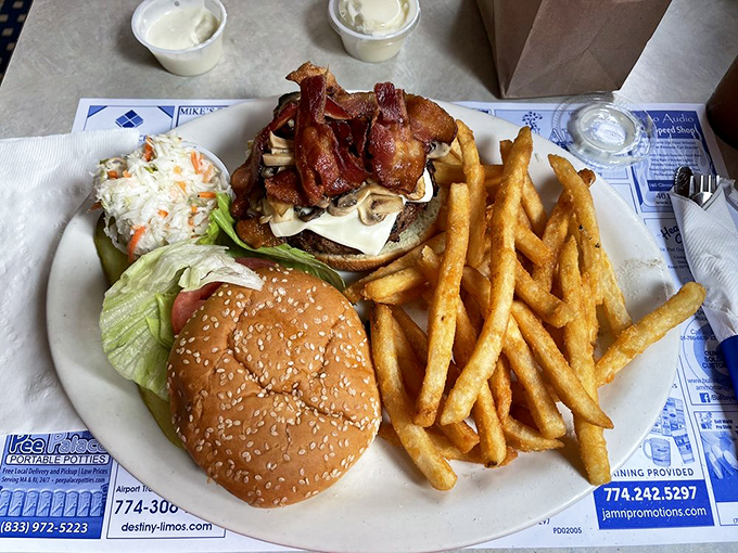 This isn't just a burger, it's a skyscraper of flavor! Bacon, mushrooms, and cheese unite in a mouthwatering masterpiece that'll make your taste buds sing.