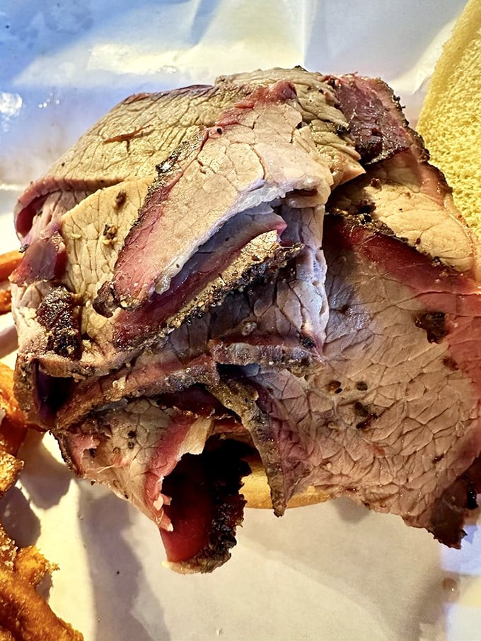 Beefy bliss between bread! This brisket sandwich is piled high with tender, flavorful meat that'll make your taste buds sing.