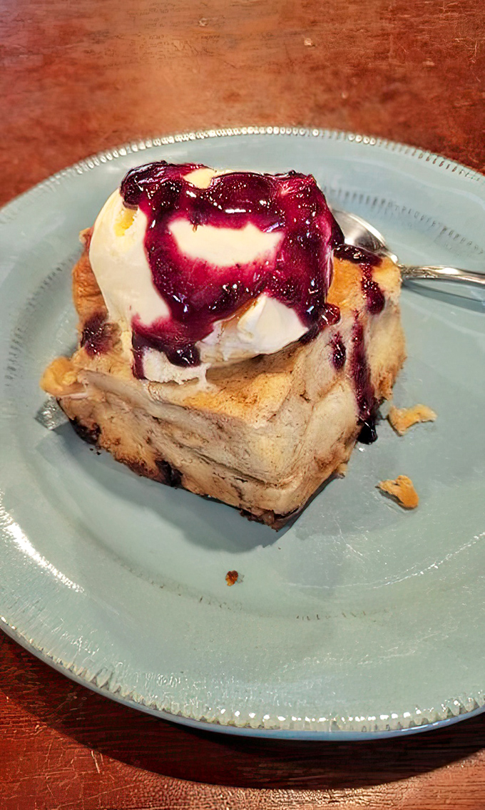 Bread pudding wearing a berry beret, proving that comfort desserts can still dress up for special occasions.