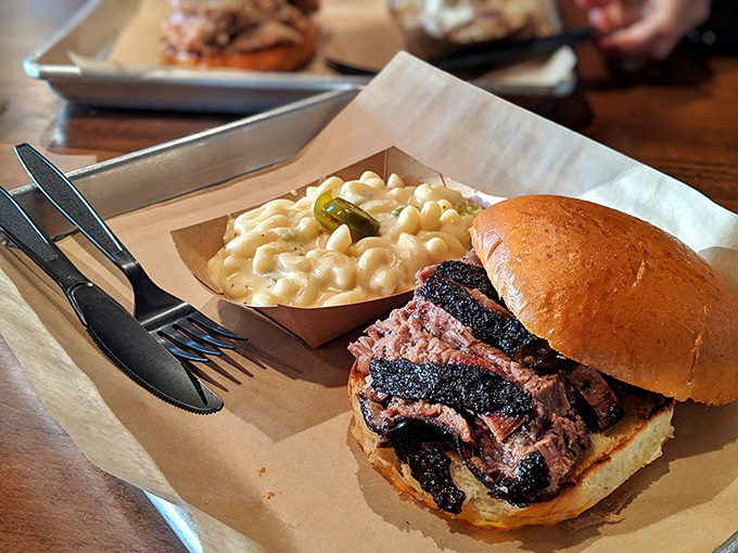 Beefy bliss between bread! This brisket sandwich is piled high with tender, flavorful meat that'll make your taste buds sing.