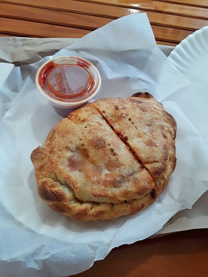 Meet the calzone: pizza's mysterious, pocket-sized cousin! It's like a delicious game of "guess what's inside" for your mouth.