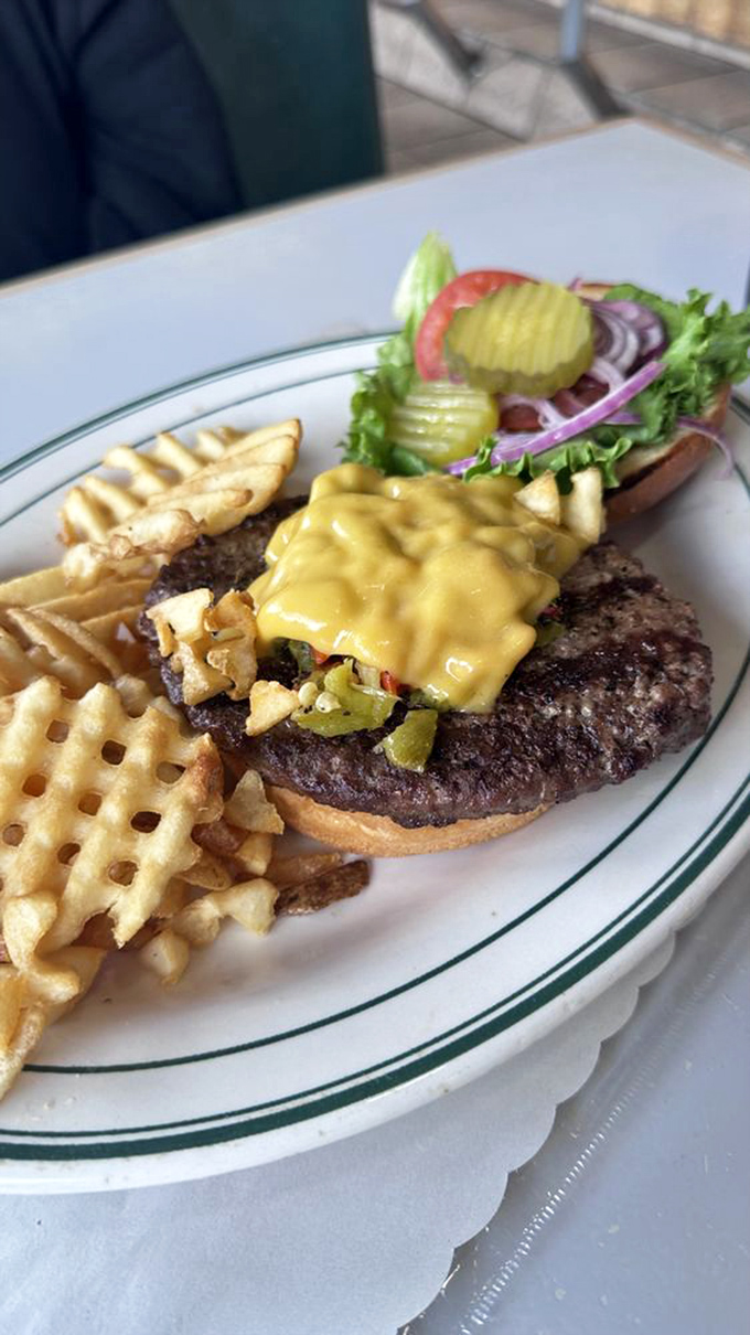 This isn't just a burger; it's a masterpiece of melted cheese and green chiles that makes you wonder why you'd ever order anything else.