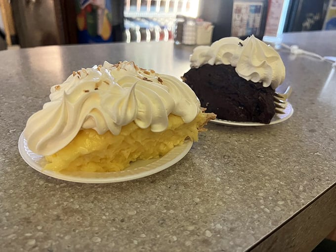 Two slices of heaven—coconut and chocolate cream pies with meringue so high it needs its own zip code.