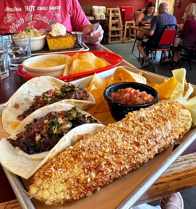 Street corn meets barbecue tacos in a cultural handshake that proves good flavors transcend borders.