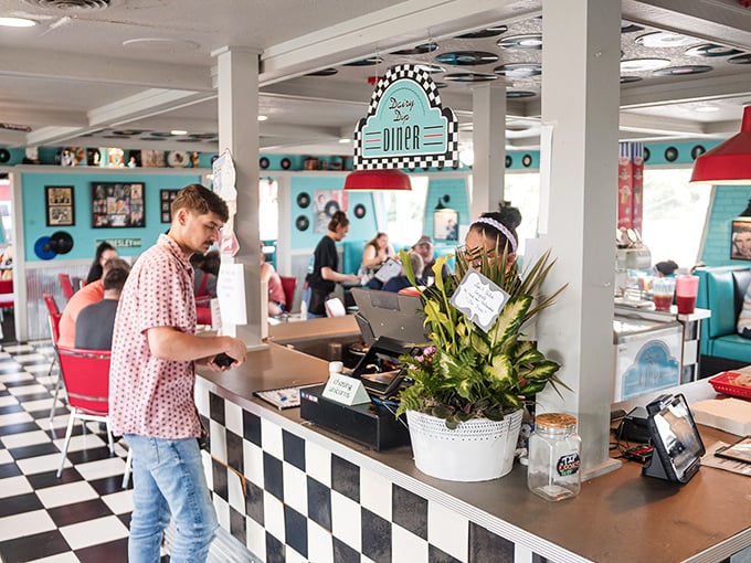 Order up! The heart of any great diner is its counter, and this checkerboard beauty is where the magic happens. Time to grab a stool and watch the show!