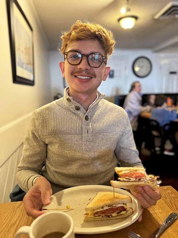 A smile brighter than the breakfast special! This happy diner embodies the joy of a perfect meal, proving that at Crystal Restaurant, satisfaction is always on the menu.