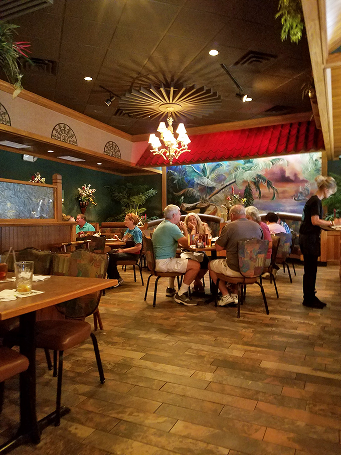 Happy diners, tropical murals, and the buzz of conversation – it's not just a meal, it's a full-sensory BBQ experience!