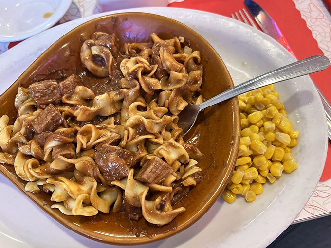 Beef tips and noodles swimming in gravy that could unite political opponents. That side of corn isn't negotiable—it's essential for sopping up every last drop.