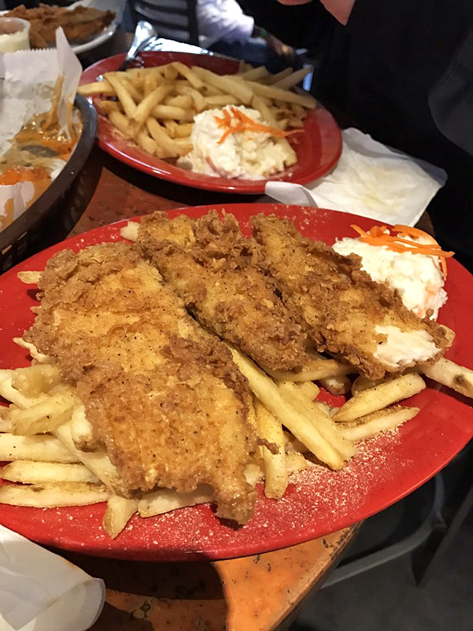 Golden-brown perfection on a plate! This fish and chips duo is crispier than a new dollar bill and twice as valuable to a hungry diner.