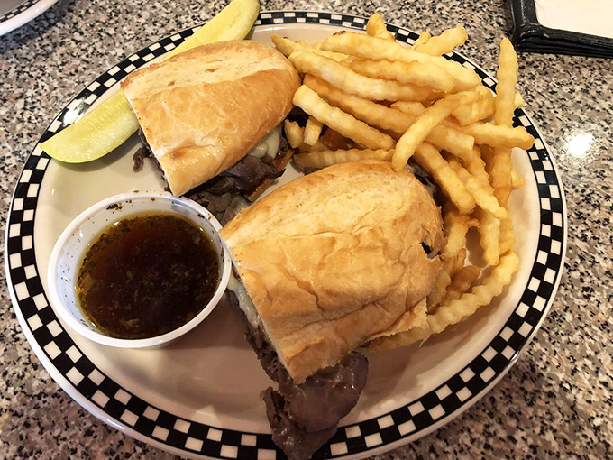 The French Dip that'll make you want to say "Oui, oui!" Golden fries stand at attention, ready for their au jus bath.