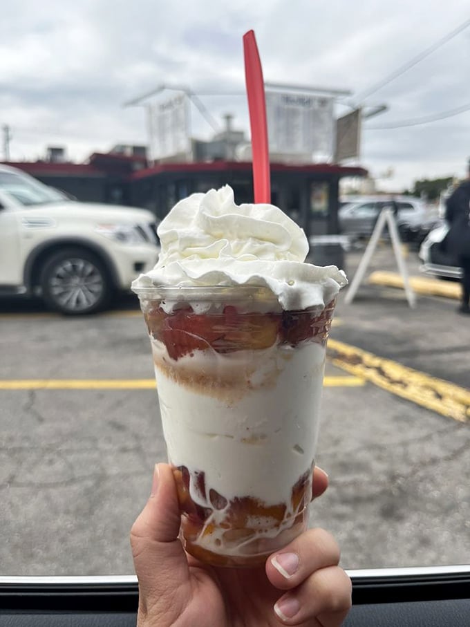 Sweet dreams are made of this! This fresh peach sundae is summer in a glass, topped with a cloud of whipped cream.