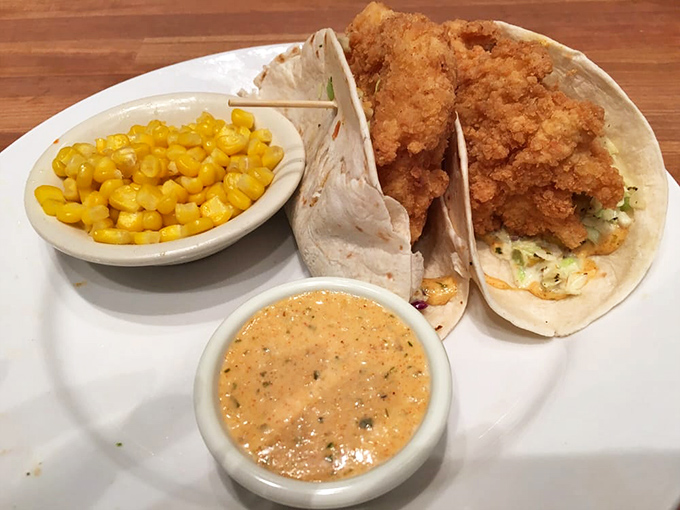 Fish tacos that bring a little coastal flair to the Midwest, with a side of sweet corn and a sauce that ties it all together.
