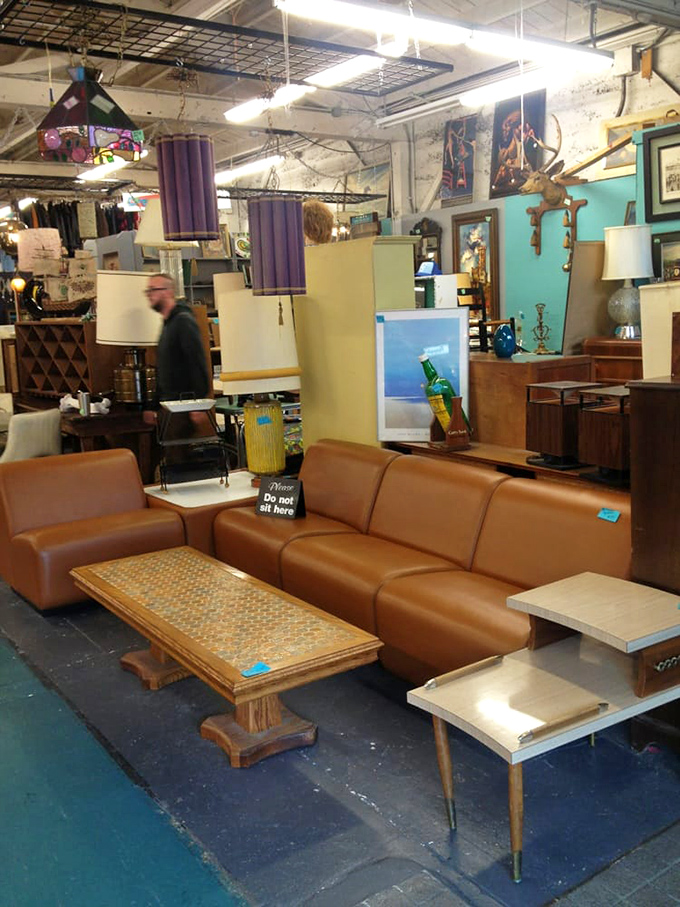 That caramel-colored sectional has seen conversations from another decade—now waiting for its second act in someone's retro-cool living room.