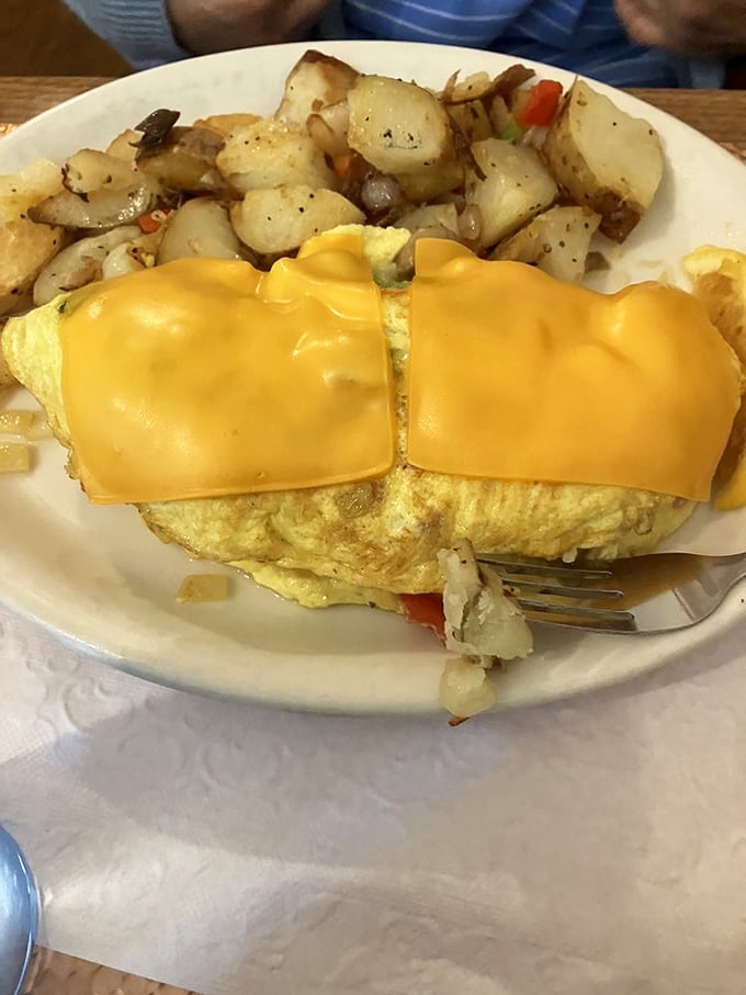 This isn't just an omelet; it's a garden party in your mouth! Packed with veggies and cheese, it's breakfast bliss on a plate.