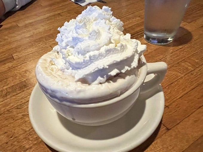 Cloud nine in a cup! The Kettle's hot chocolate arrives topped with a whipped cream mountain so high, you might need oxygen to reach the peak.