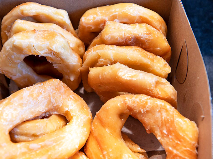 Behold, the holy grail of donuts! These glazed wonders are so light, they might float away if not for their box.