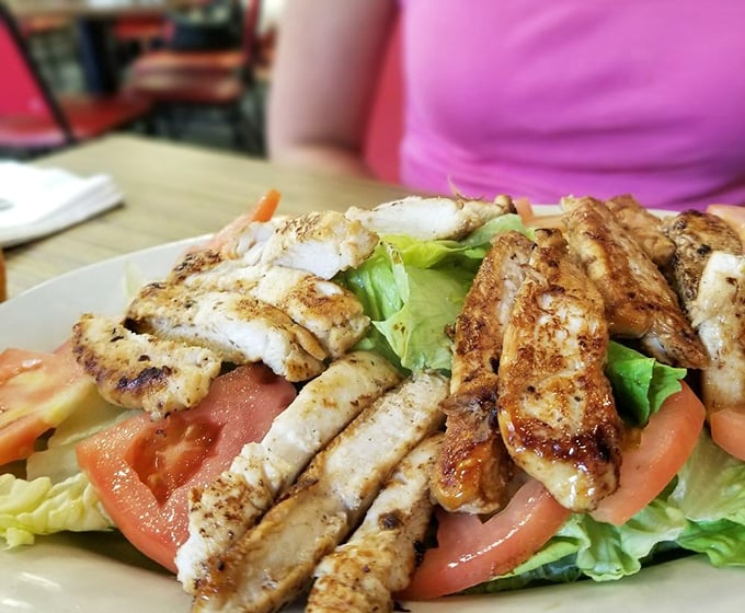 A grilled chicken salad for those who want to pretend they're eating healthy. The generous portion means you can still waddle out feeling satisfied.