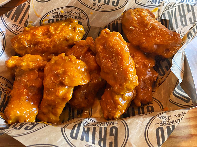 Honey gold wings glistening with saucy potential&mdash;these aren't just wings, they're flavor vehicles delivering pure joy to your mouth.